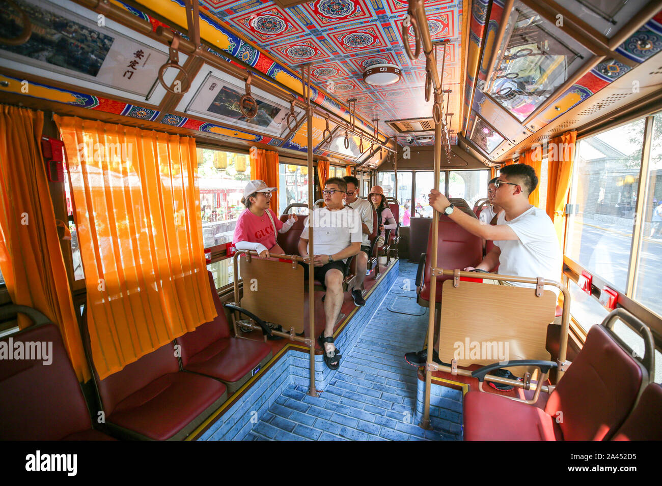 Passengers experience the old-fashioned bus in Xi’an city, northwest ...