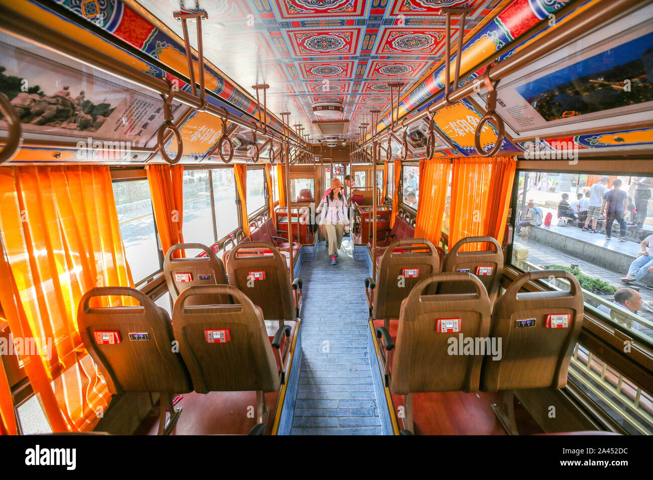 Passengers experience the old-fashioned bus in Xi’an city, northwest ...