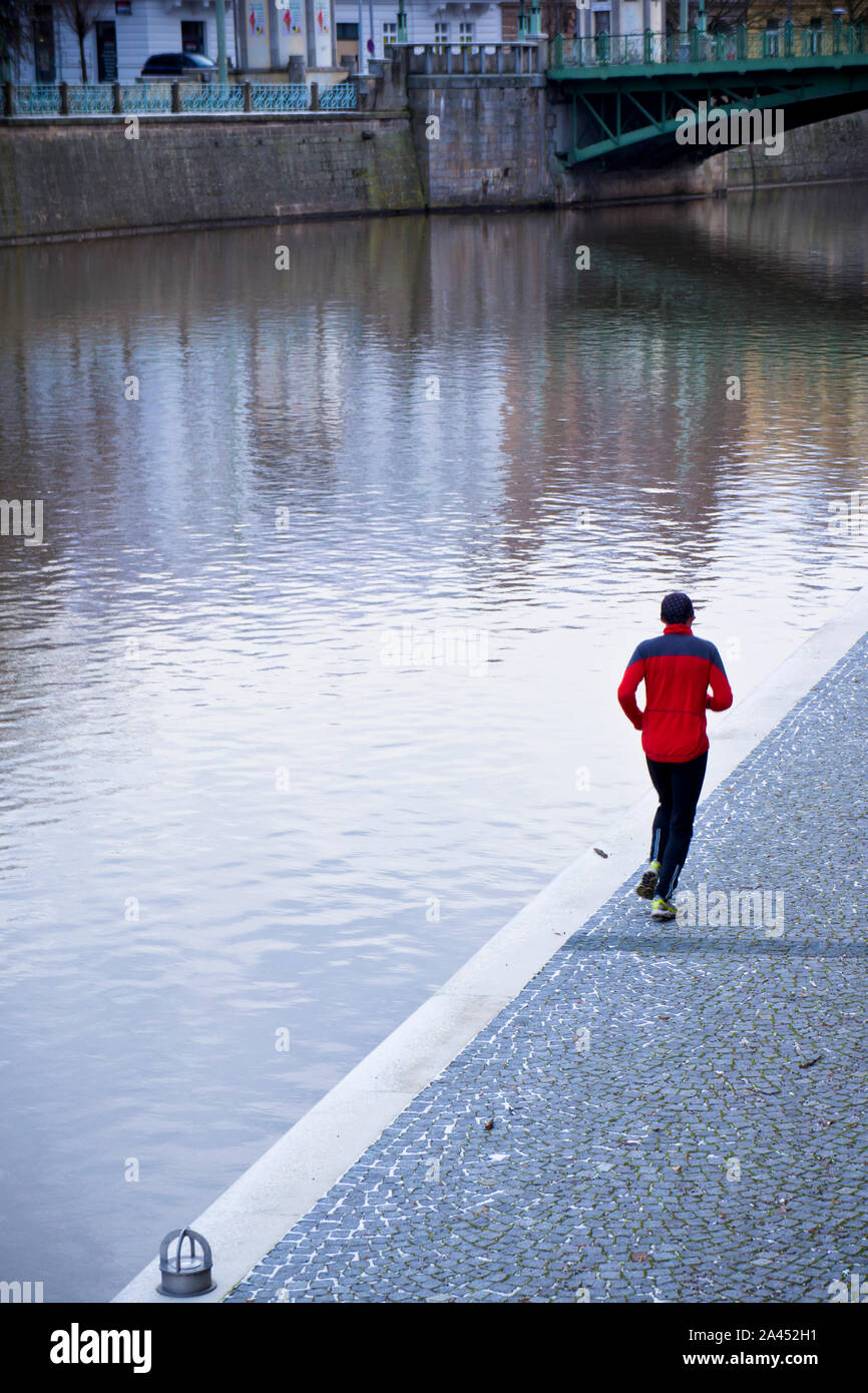 running athlete training along a river Stock Photo - Alamy