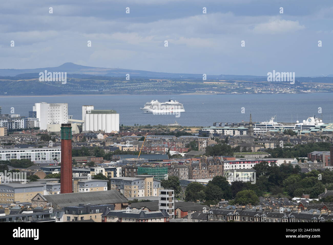 The town of Leith from Calton Hill with a cruise liner ready to dock to ...