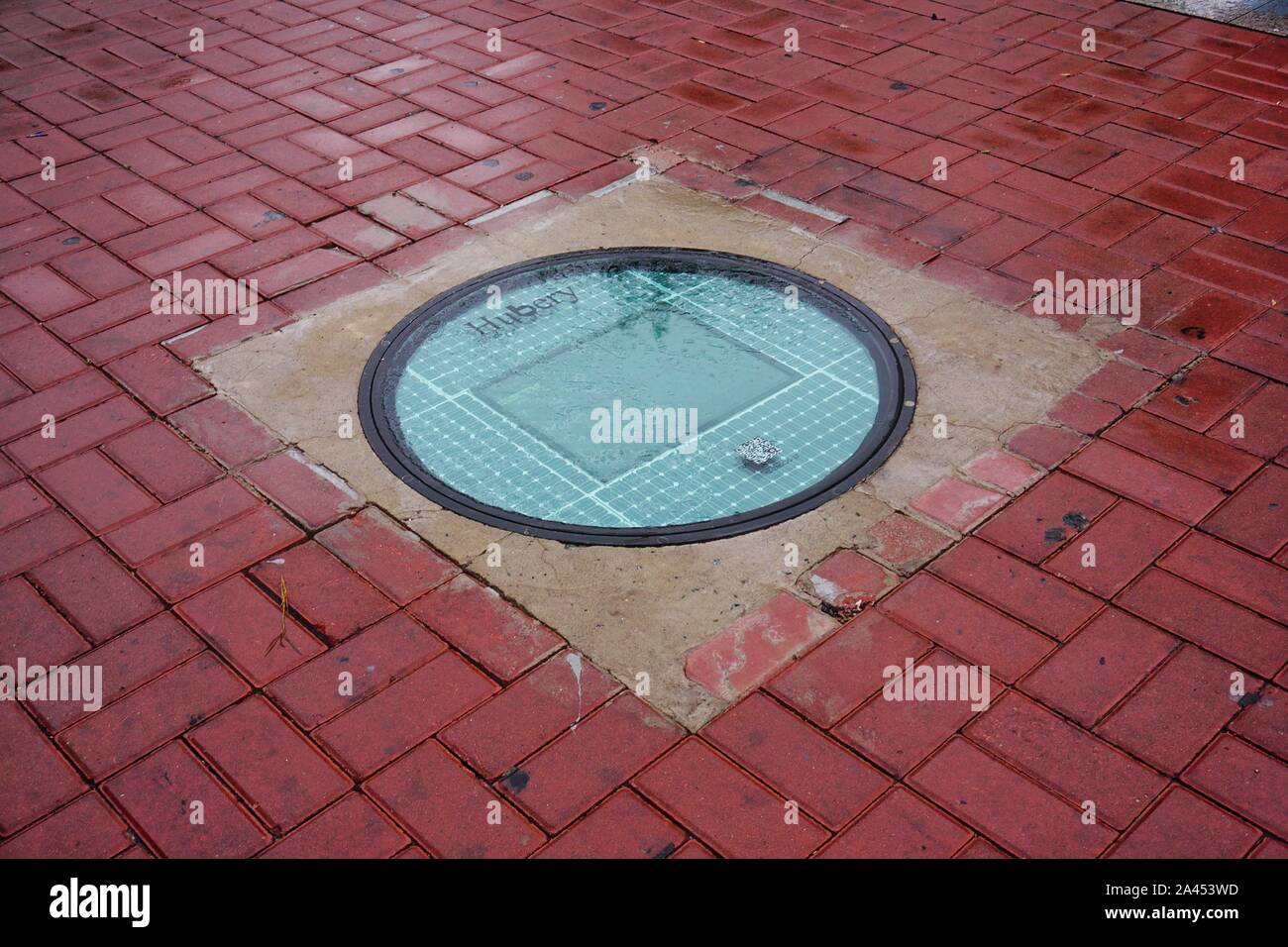 A smart well lid appears and attract attention of pedestrian at West ...