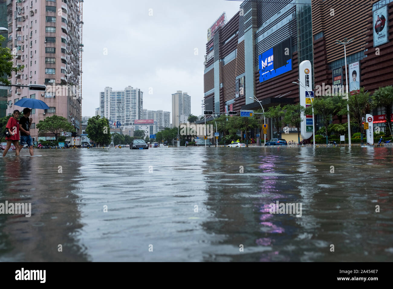 A road is submerged by floodwater after a heavy rainstorm caused by ...