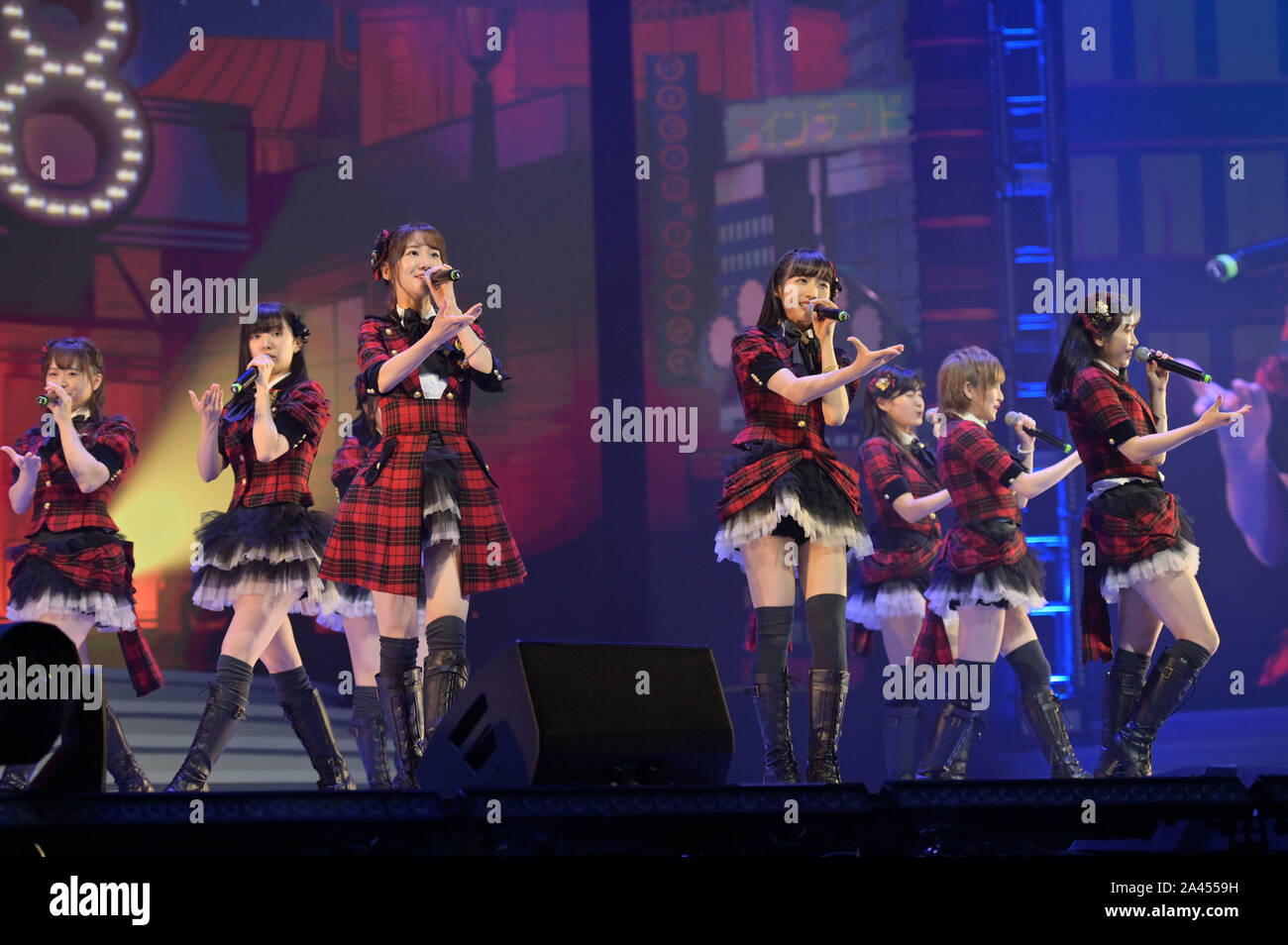 Members of Japanese idol girl group AKB48 and its international sister groups perform during the ...