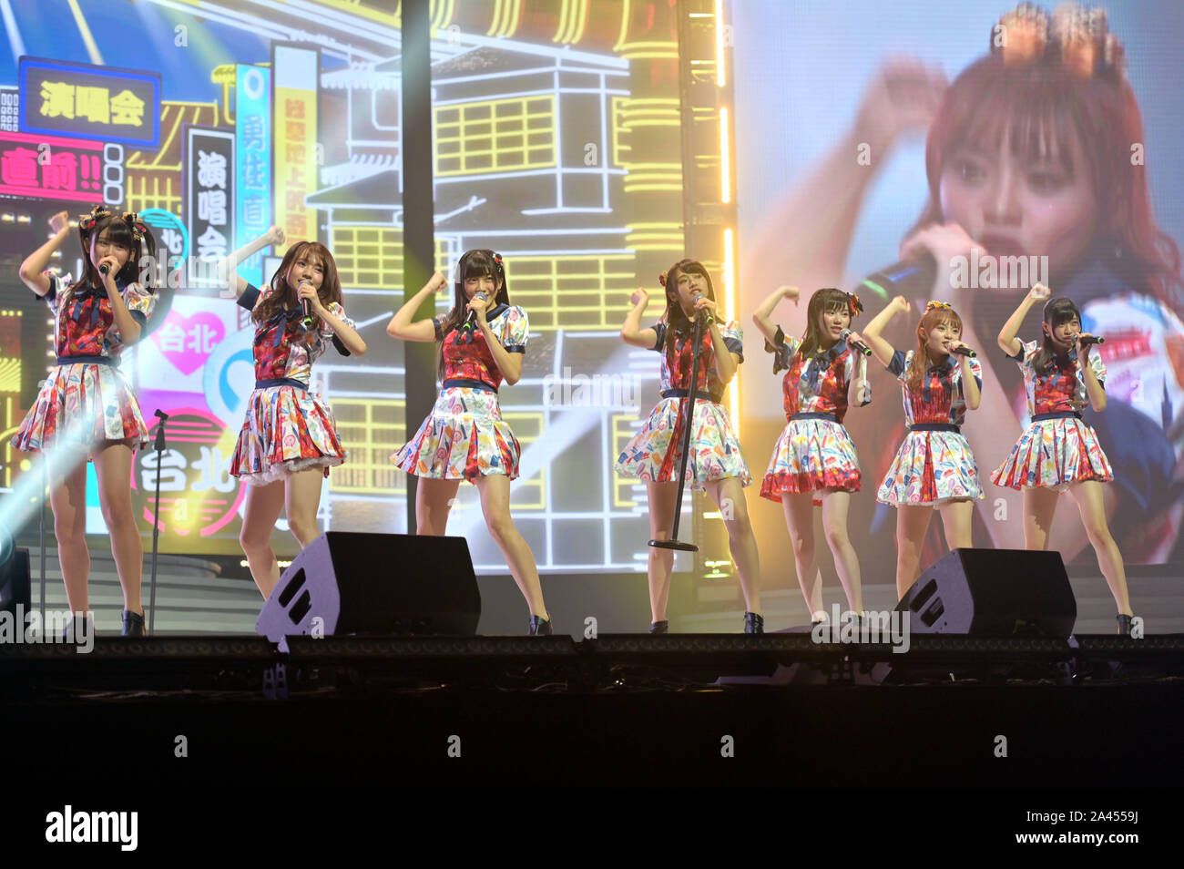 Members of Japanese idol girl group AKB48 and its international sister ...