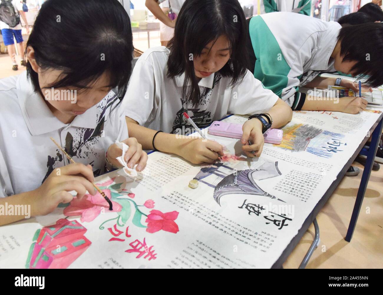 Students design and draw during Chinese self-designed newspaper ...