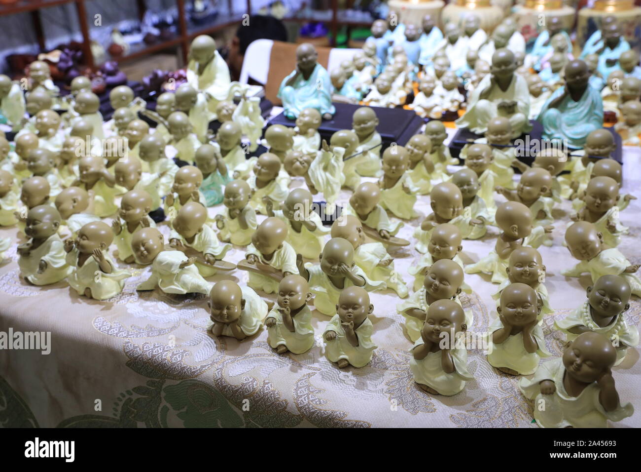 Cute sculptures featuring shape of monks are displayed during the 7th ...