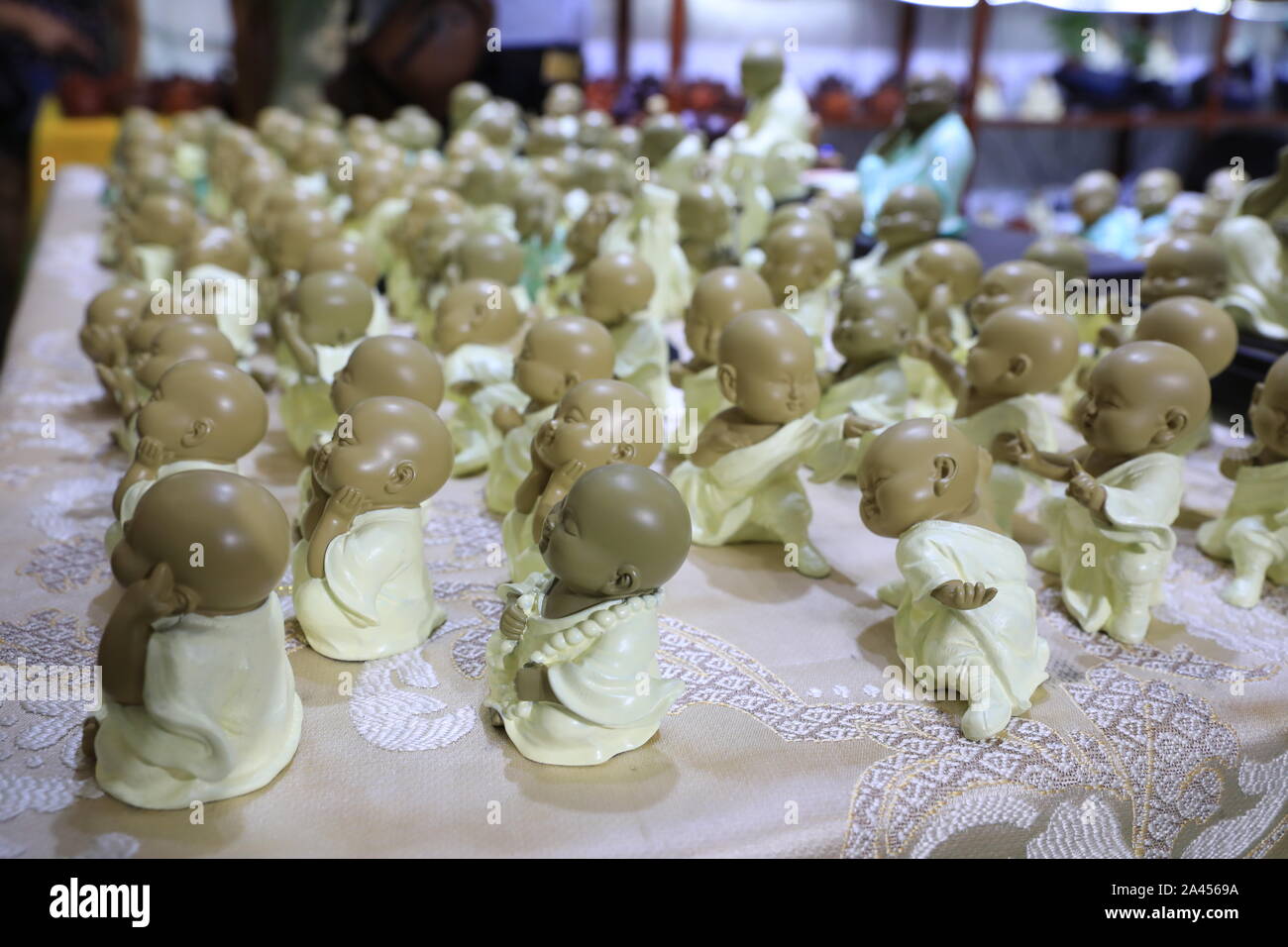 Cute sculptures featuring shape of monks are displayed during the 7th ...