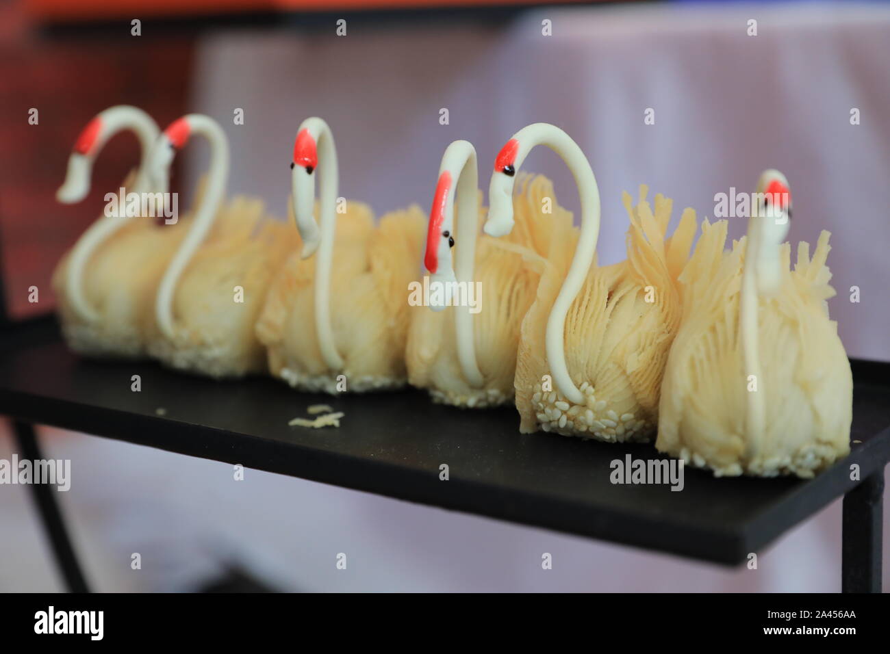 The desserts featuring the shape of swans are displayed during the 7th ...