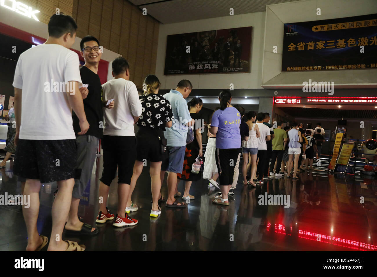 Chinese filmgoers wait inside a cinema to watch Chinese animated film ...