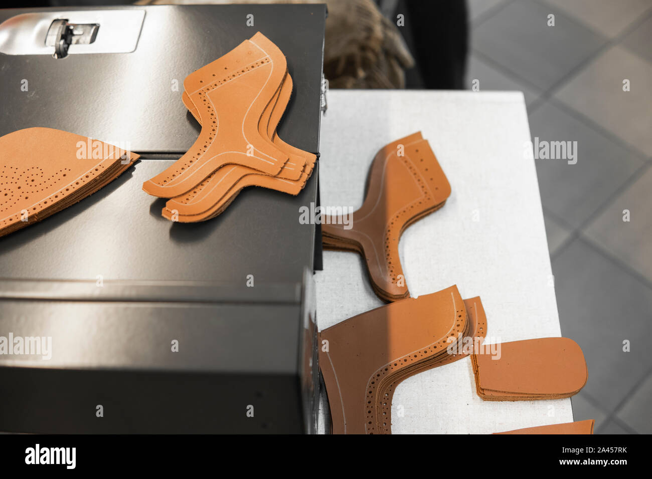 Different forms of leather pieces which will be use for making a shoes ...