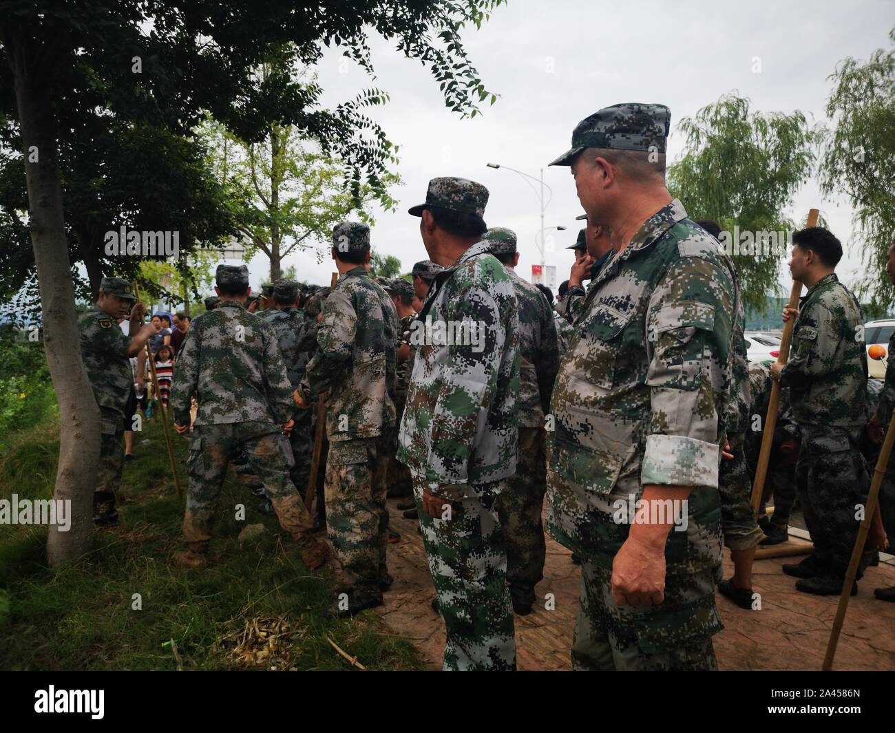 Chinese rescuers gather to help people trapped by heavy downpours and ...