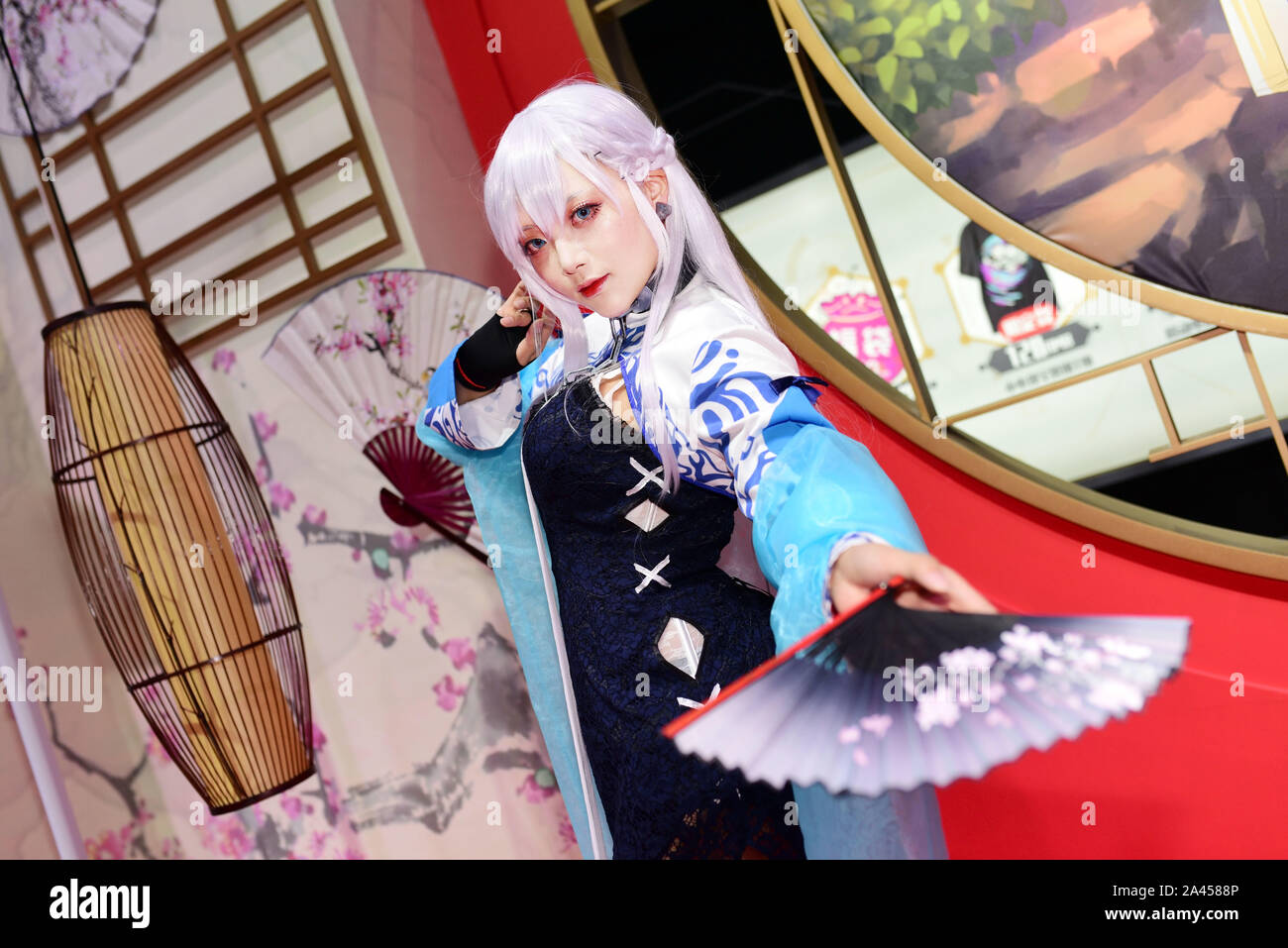 A Chinese showgirl dressed in cosplay costume featuring Belfast from ...