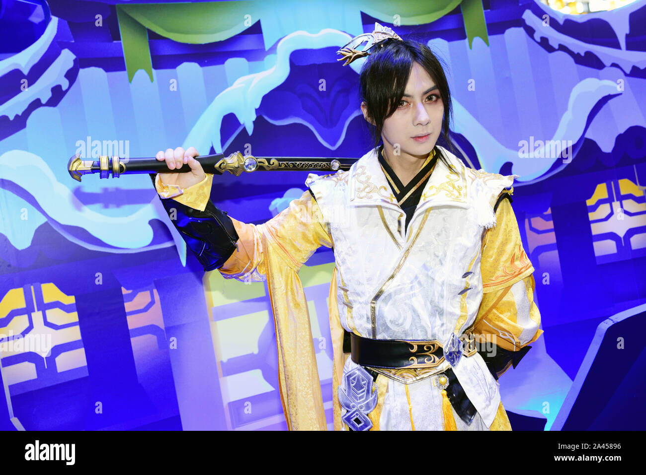 A Chinese cosplayer dressed in a character from Tencent Games poses ...