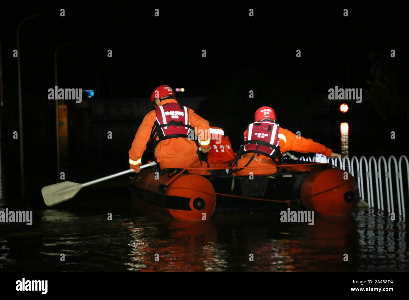 Chinese rescuers evacuate local residents in floodwater after heavy ...