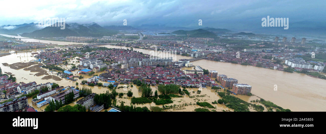 Aerial view of residential buildings and fields submerged by floodwater ...
