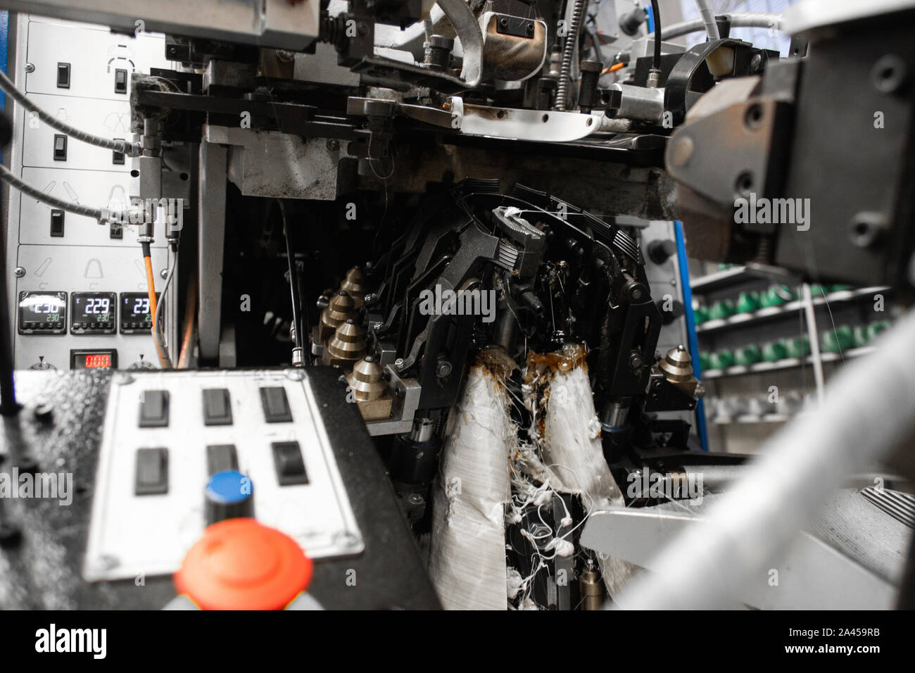 Man use special machine tool for making a shoes. The conveyor on a ...