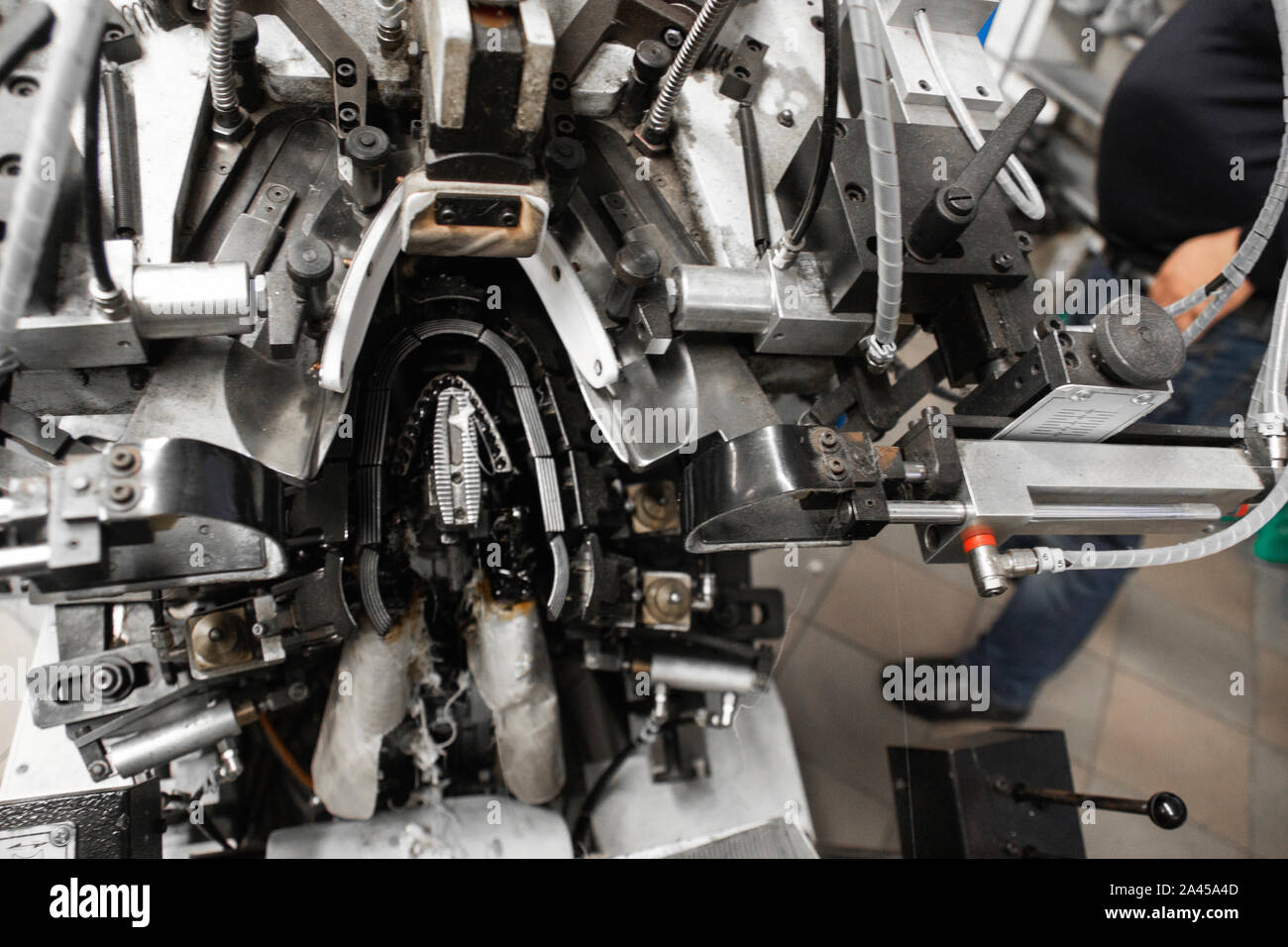 Man use special machine tool for making a shoes. The conveyor on a ...