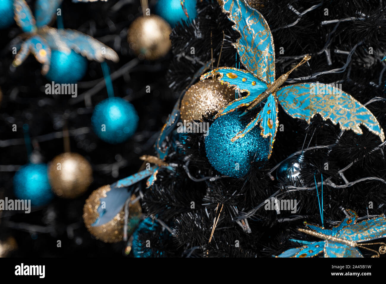 Decorated Christmas tree with a blue and gold toys and beautiful blue ...