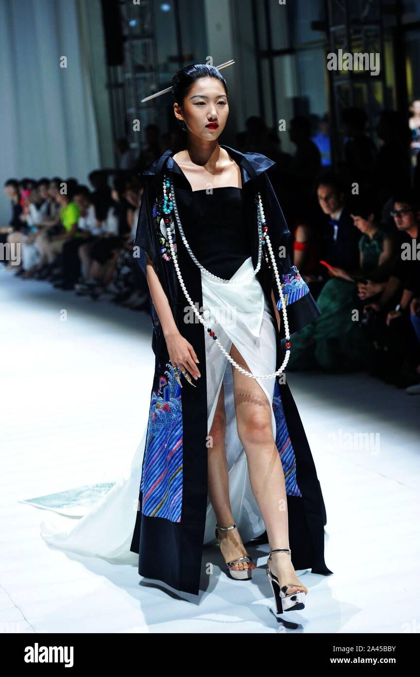 A model displays a costume featuring Chinese elements during a film ...