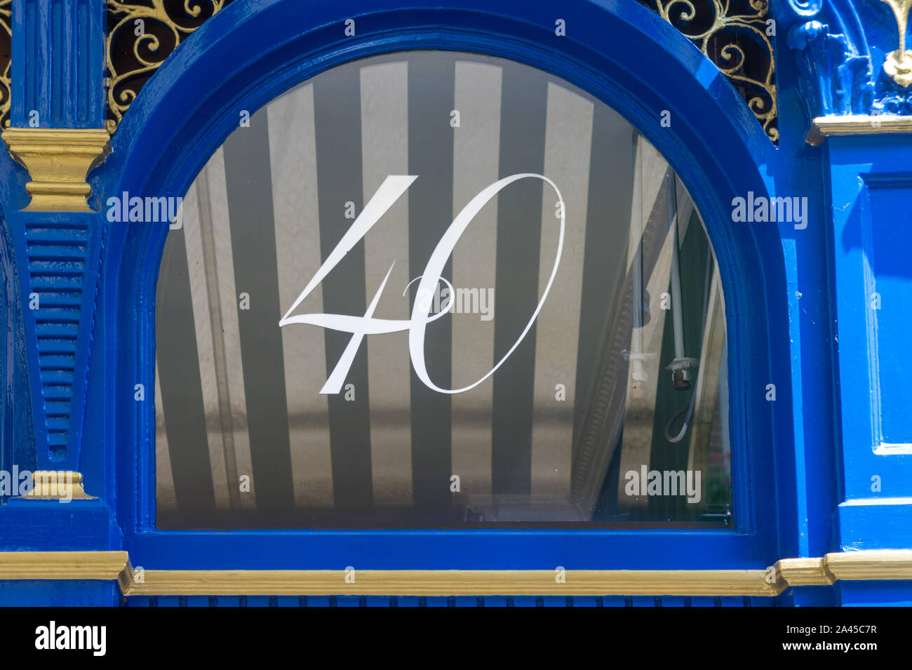 House number forty on a glass window in a colorfull facade Stock Photo ...