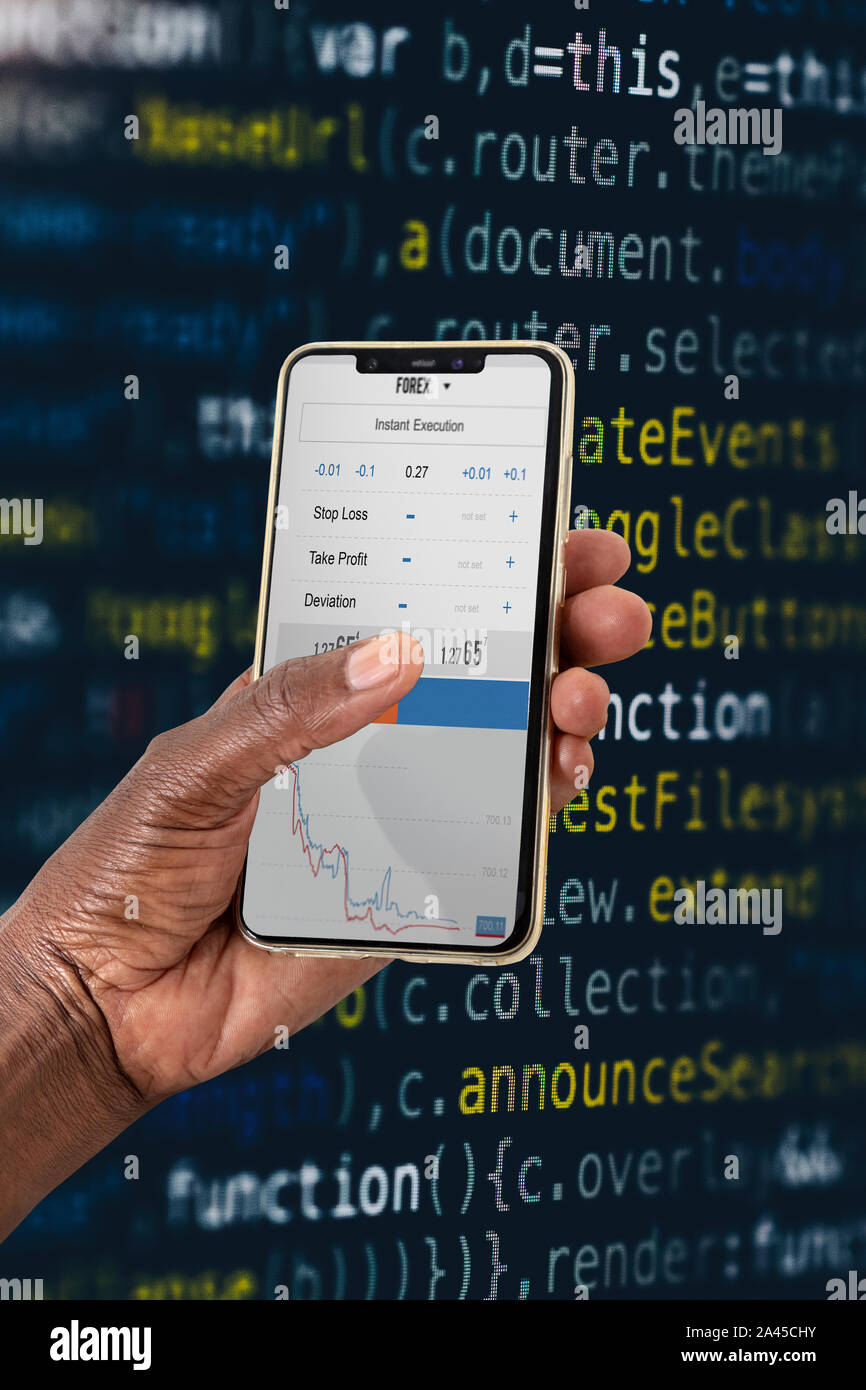 African woman hand holding a phone code blue background , with forex ...