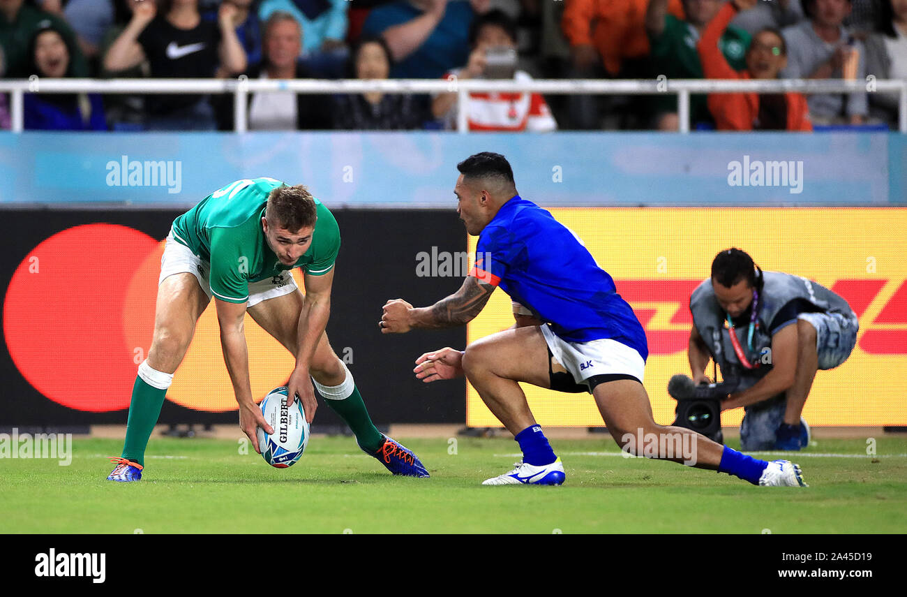Ireland's Jordan Larmour (left) scores his side's fifth try of the game ...
