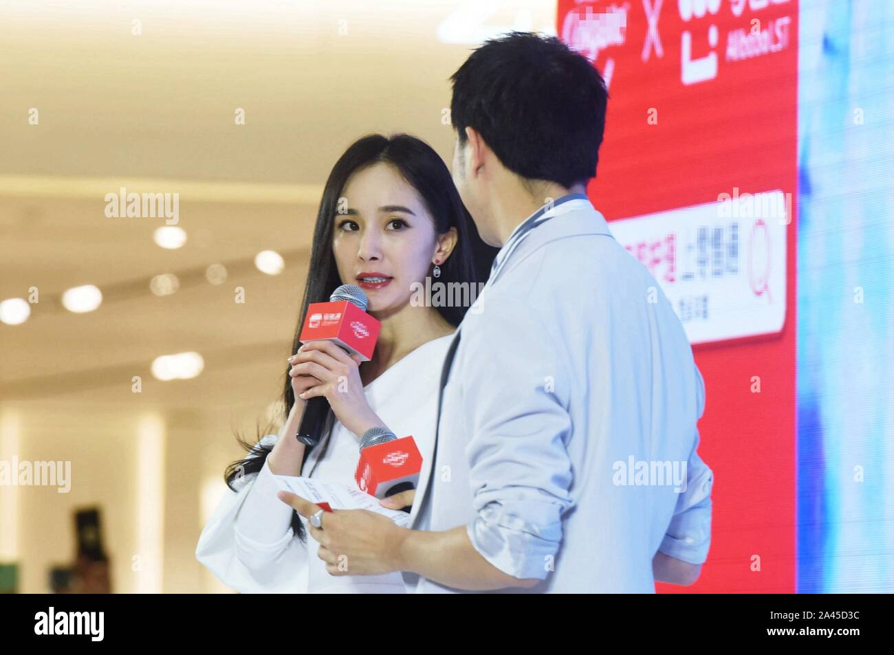 Chinese actress and singer Yang Mi, left, attends Colgate promotional ...