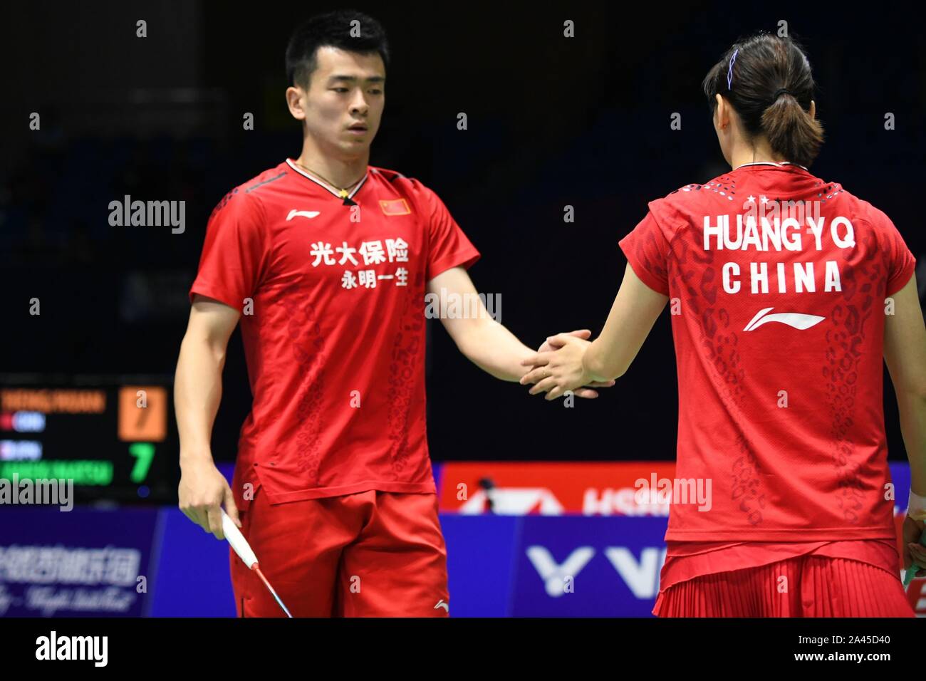 Chinese professional badminton players Zheng Siwei and Huang Yaqiong compete against Japanese ...