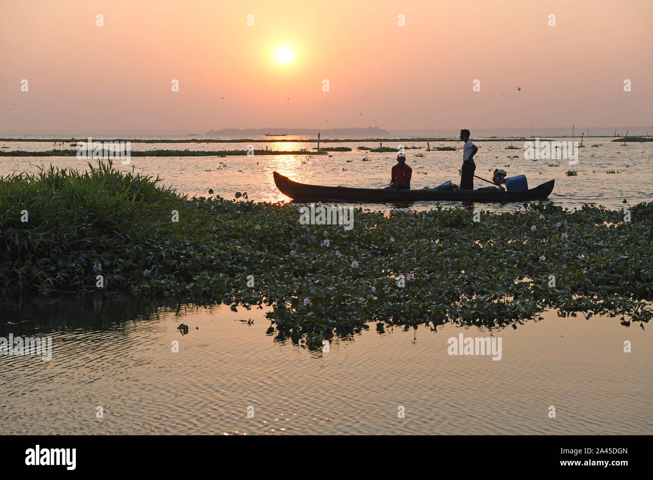 Kerala backwaters. watching the sunset over lake Vembanad in Kerala ...