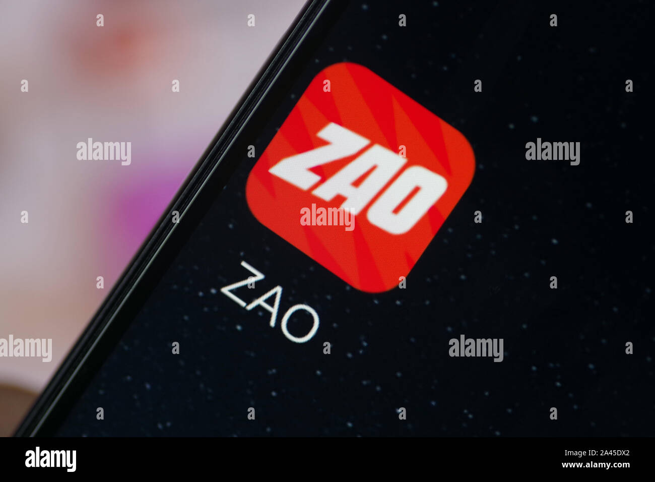 A netizen uses the mobile app of face-swapping ZAO app on his ...