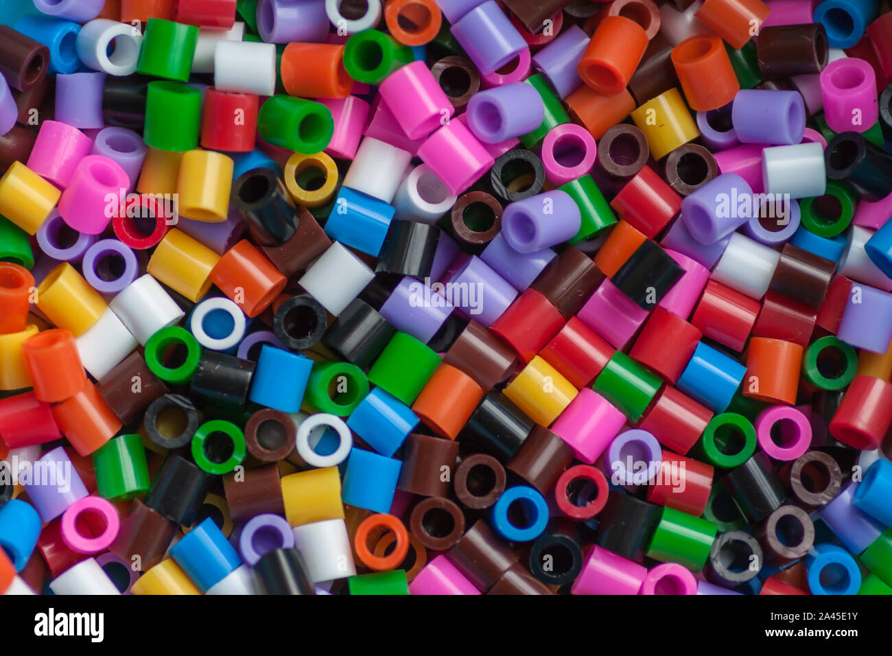 A lot of different plastic pearls for childreen Stock Photo - Alamy