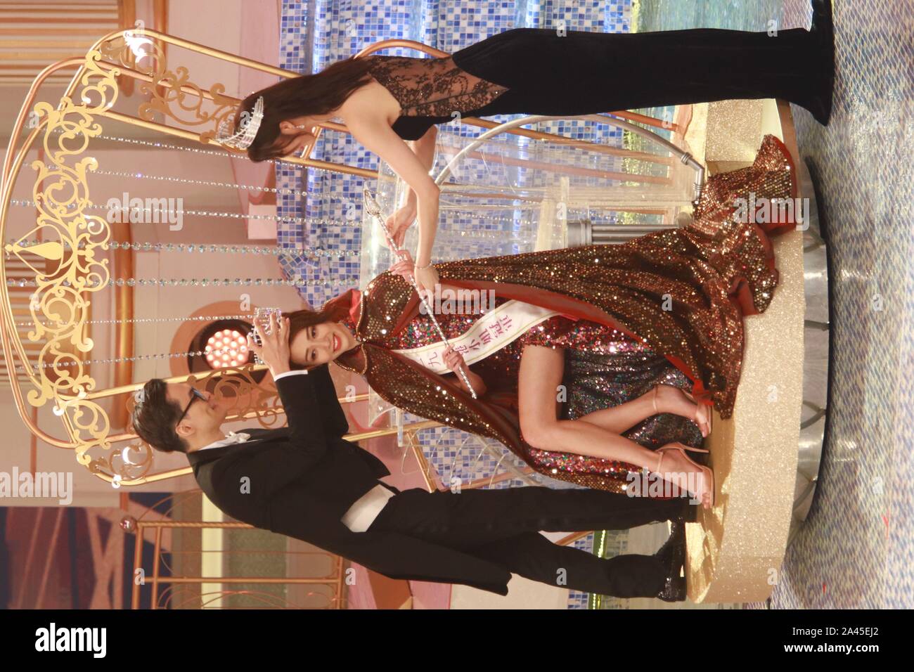 Miss Hong Kong 2018 winner Hera Chan, right, and a host crown the ...