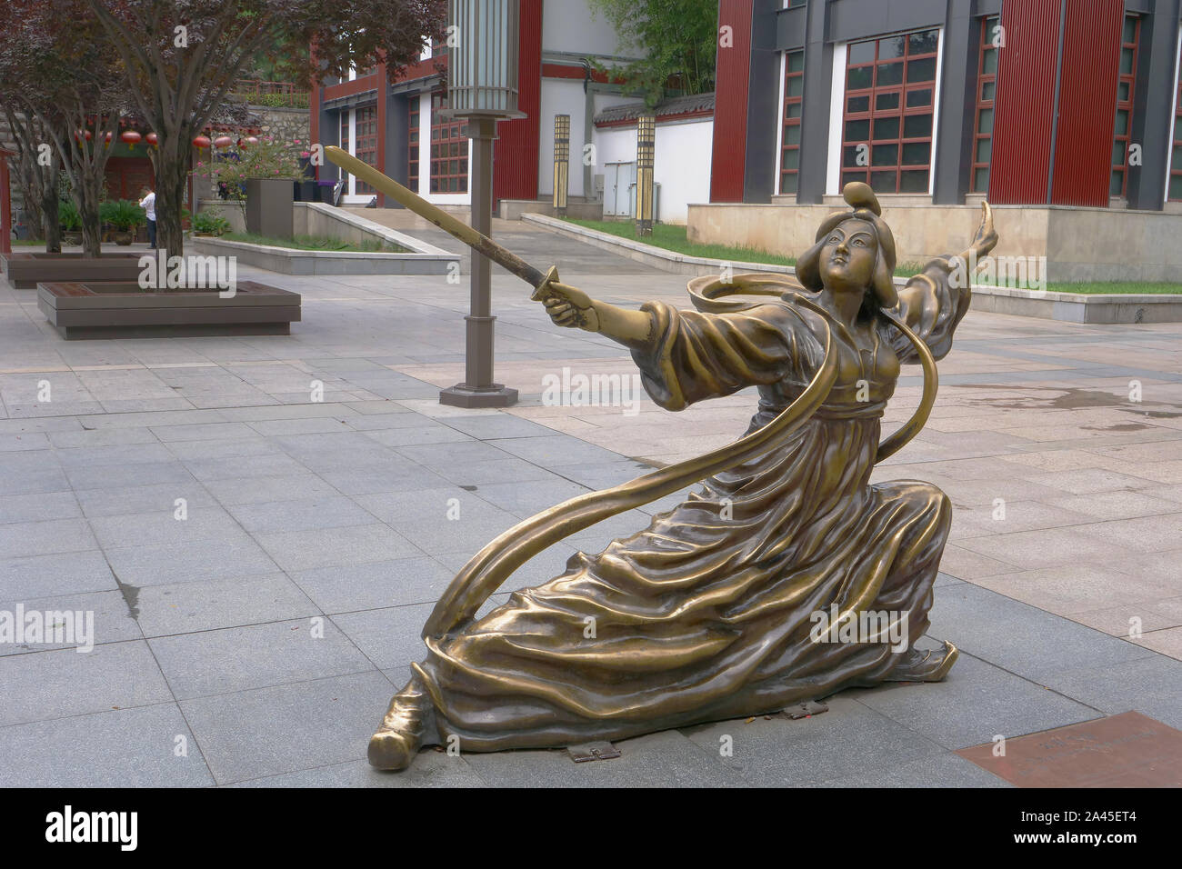 Metal copper statue of woman holding sword posing Chinese Kung Fu ...