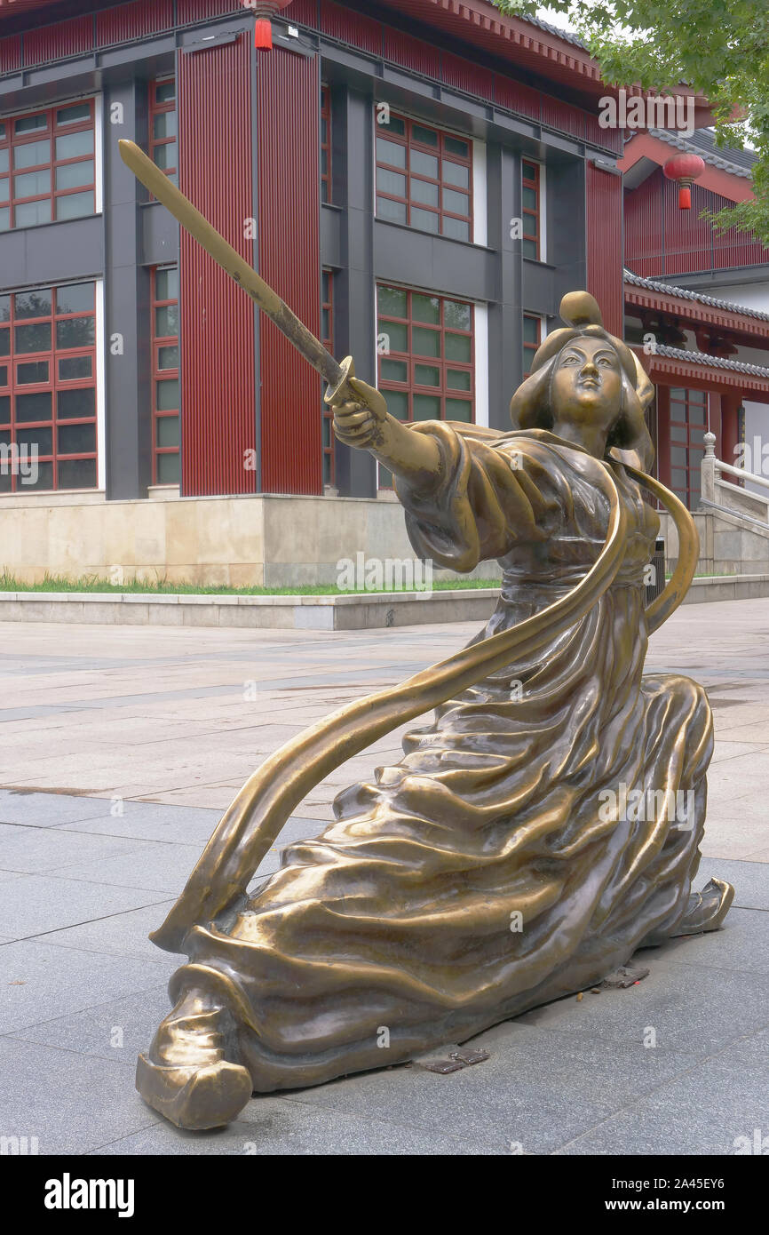 Metal copper statue of woman holding sword posing Chinese Kung Fu ...