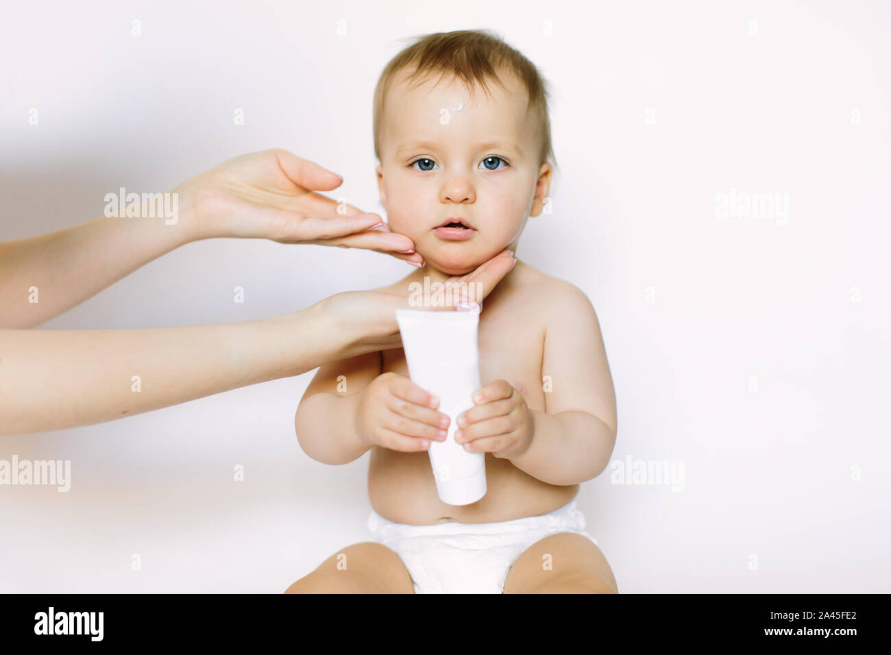 Woman creaming skin hi-res stock photography and images - Alamy