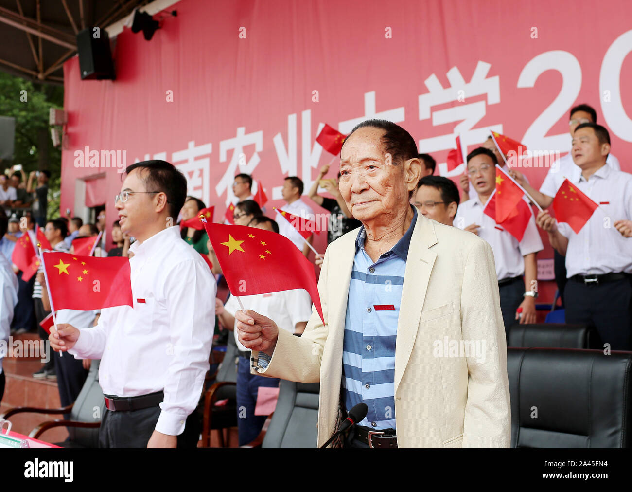 Chinese agronomist Yuan Longping, right front, known for developing the ...