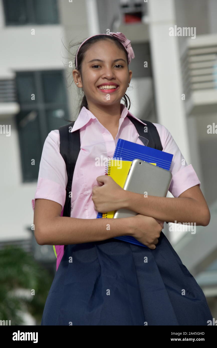Smiling Young Girl Student Wearing Skirt Stock Photo - Alamy
