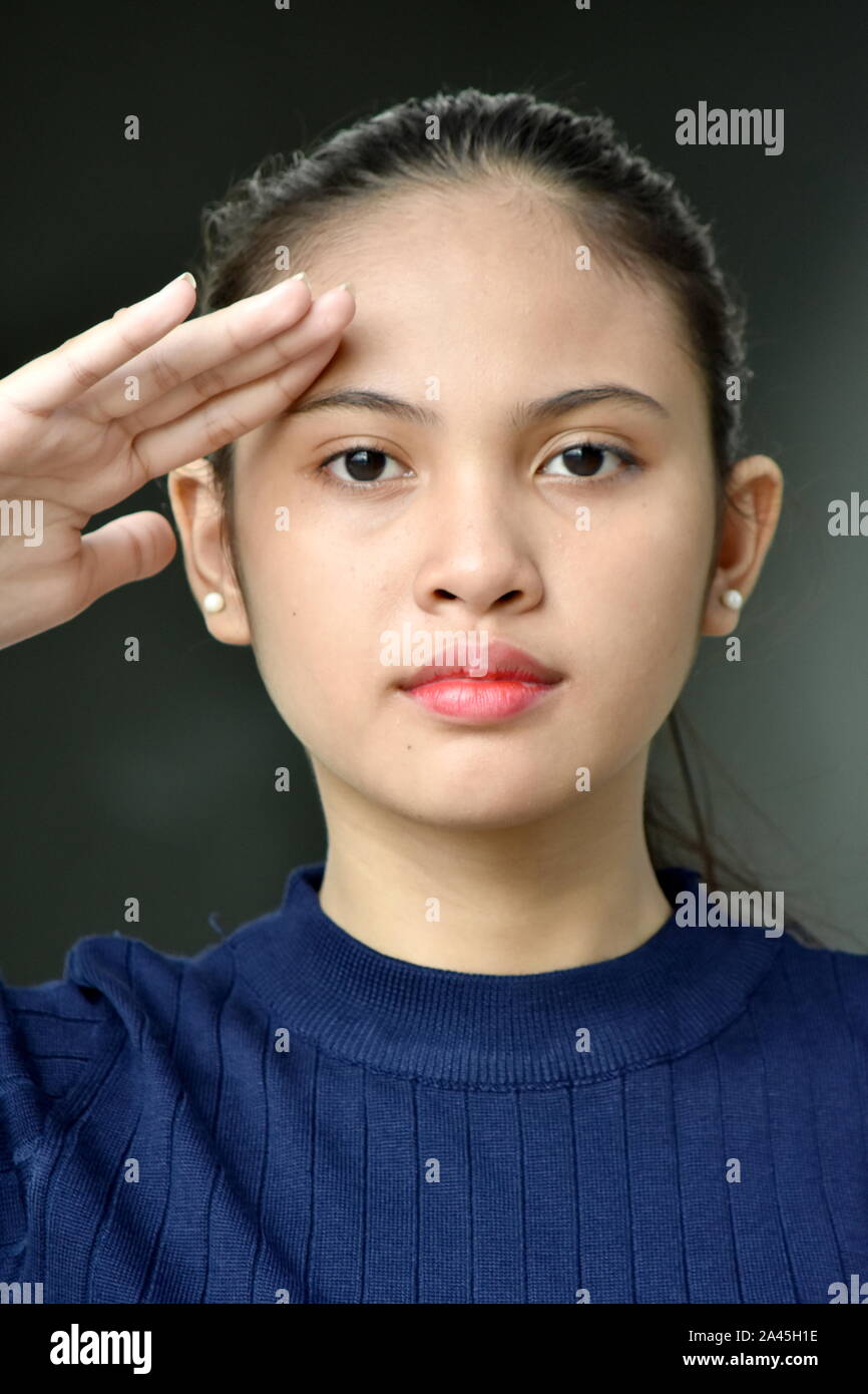 Youthful Asian Girl Saluting Stock Photo - Alamy