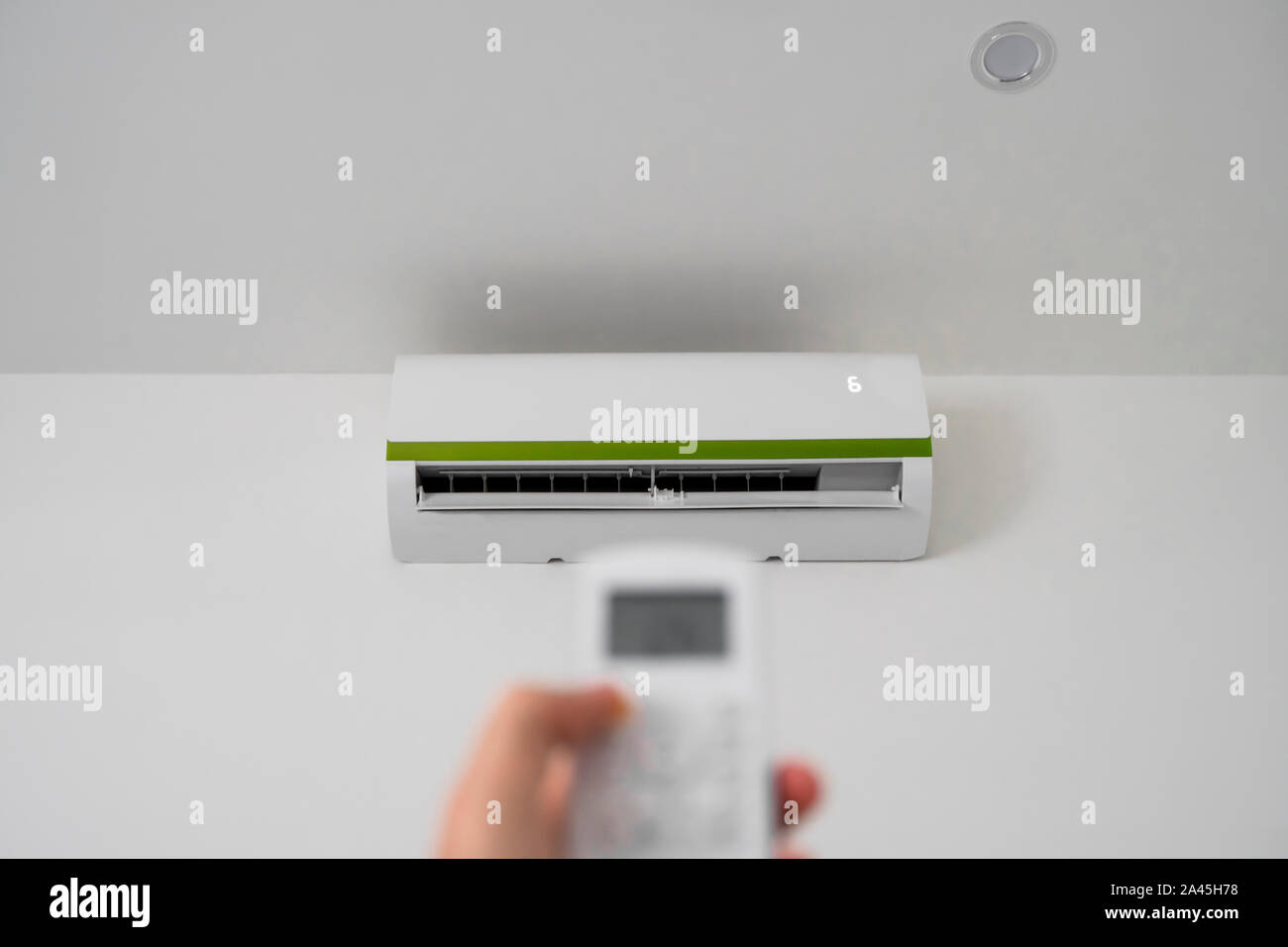 Man's hand using remote controler. Hand holding rc and adjusting ...