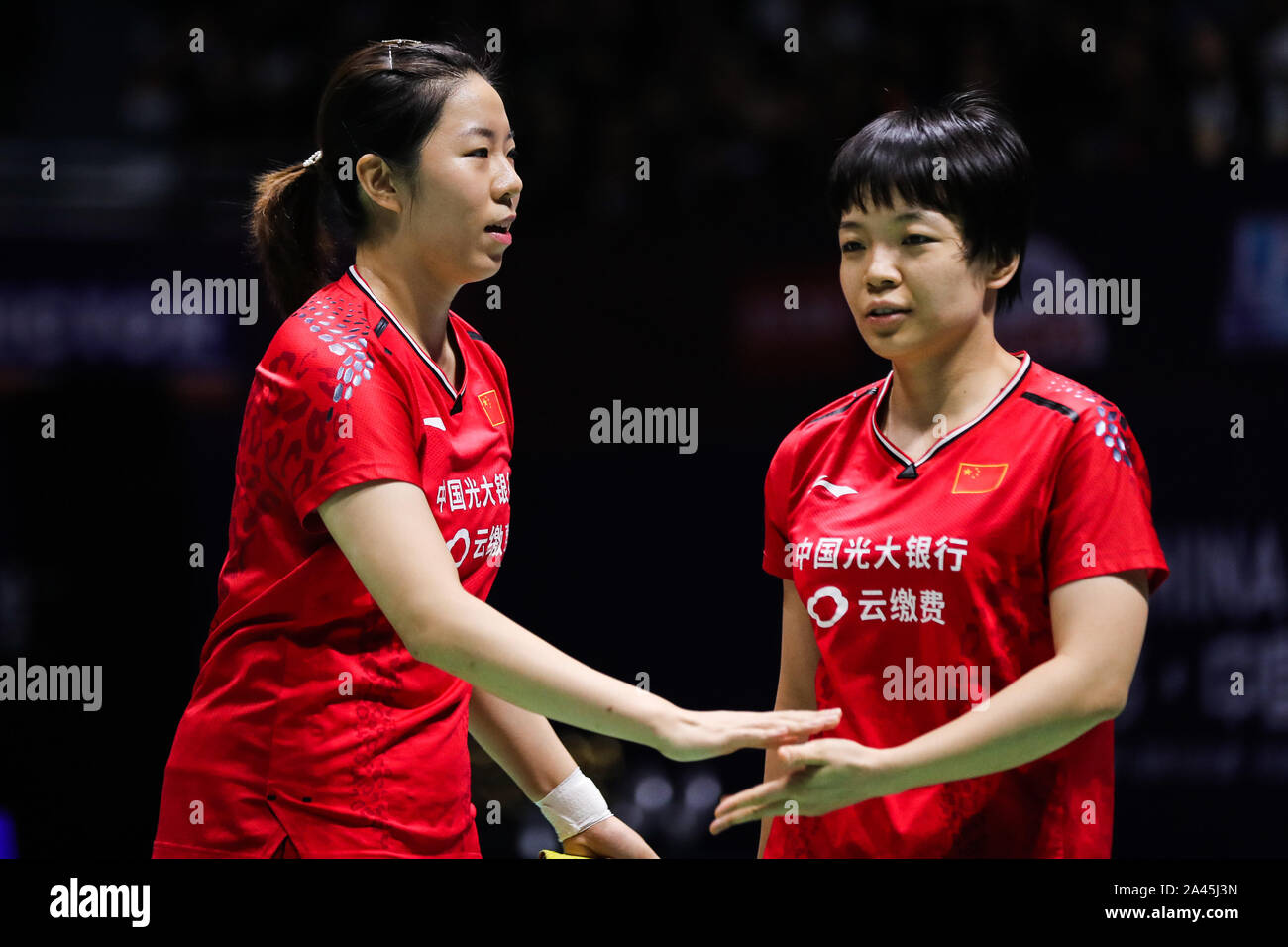 Chinese professional badminton players Jia Yifan and Chen Qingchen compete against Japanese ...