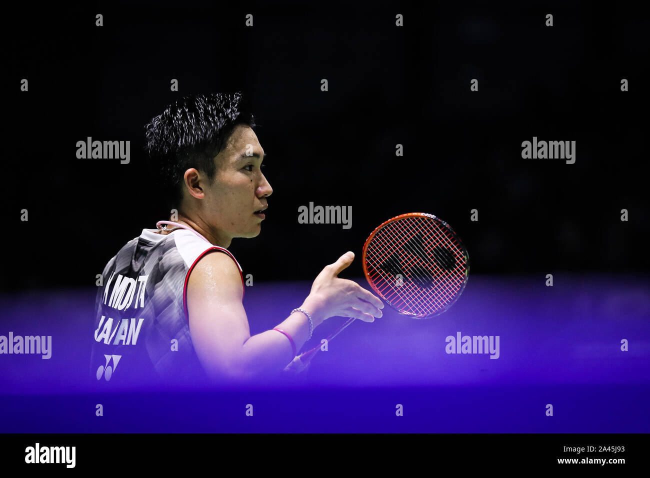 Japanese professional badminton player Kento Momota competes against ...