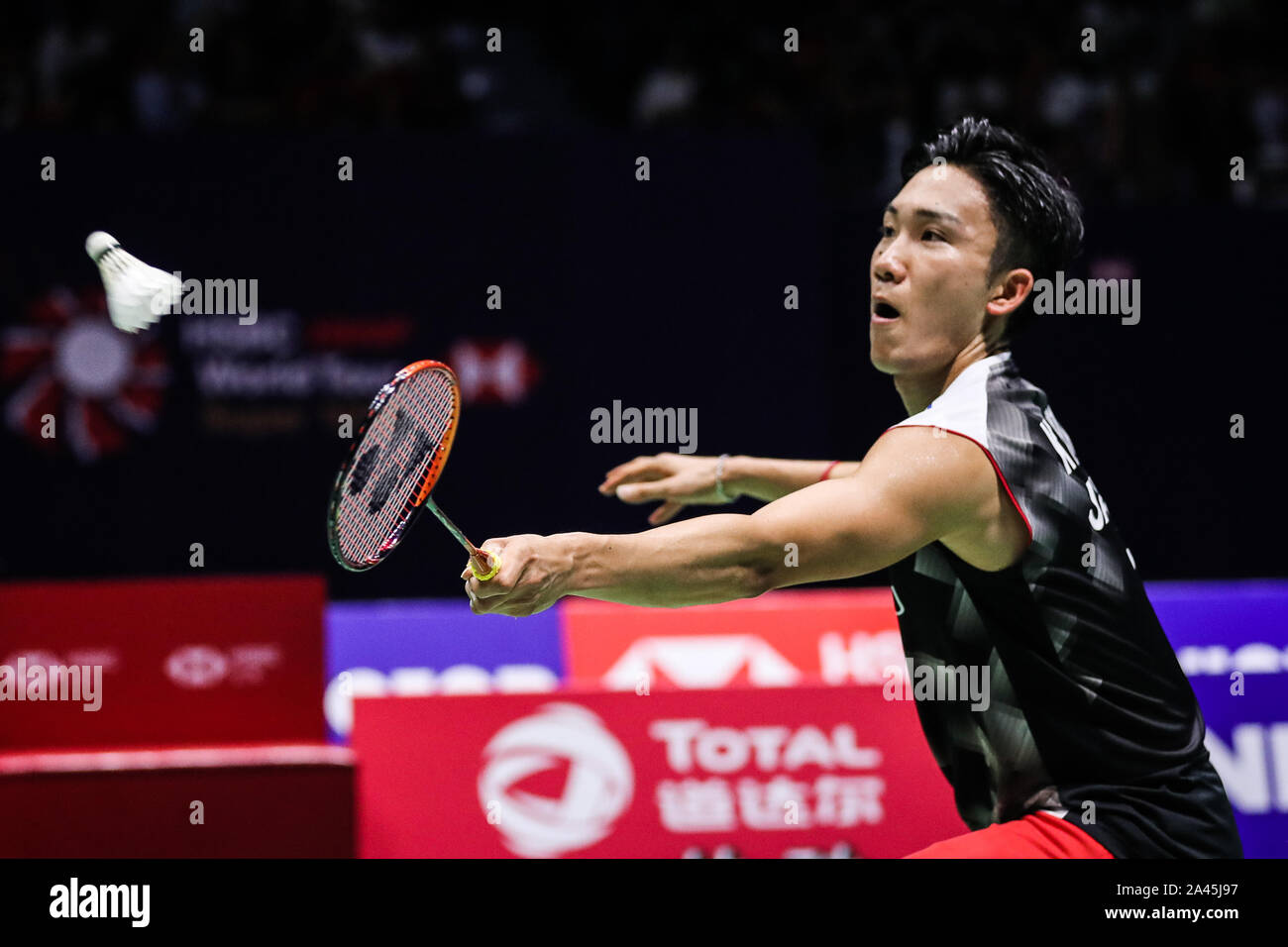 Japanese professional badminton player Kento Momota competes against ...