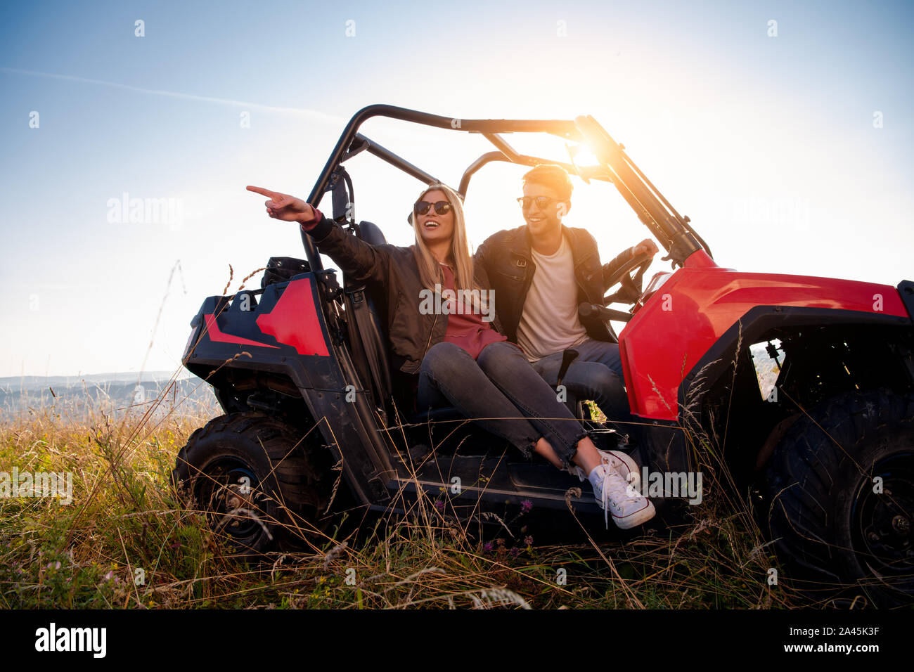 portrait of young happy excited couple enjoying beautiful sunny day ...