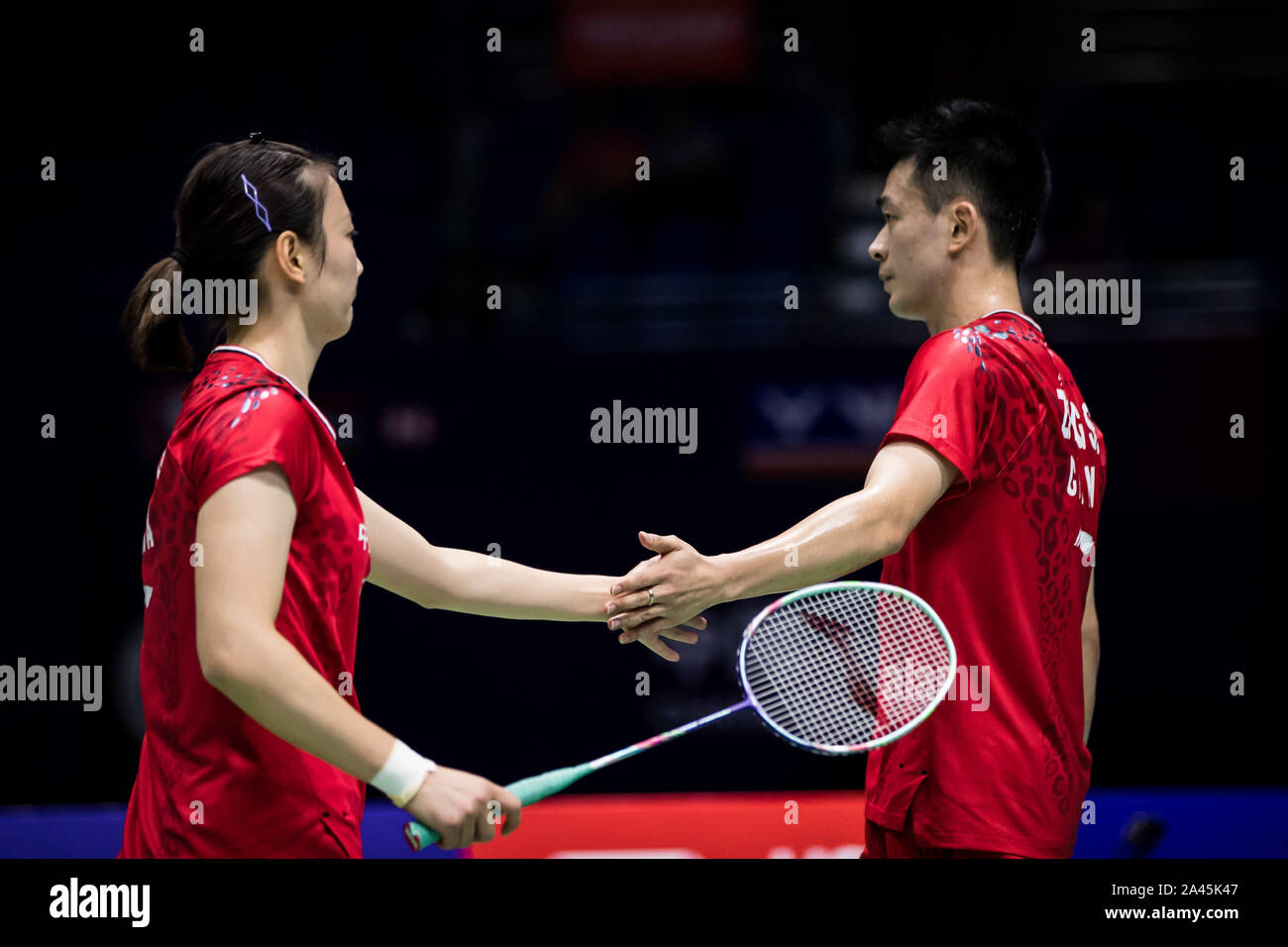 Chinese professional badminton players Zheng Siwei and Huang Yaqiong compete against Japanese ...