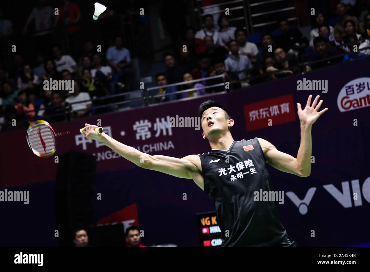 Chinese professional badminton player Chen Long competes against China ...