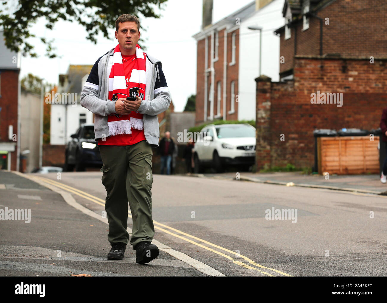 An Exeter fan makes his way to St James Park pitch before kick off ...