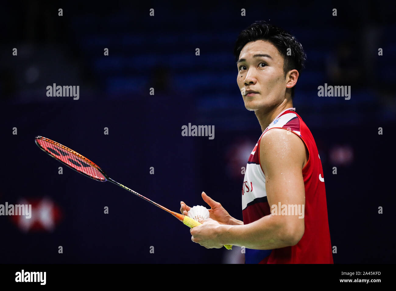 Japanese professional badminton player Kento Momota competes against ...