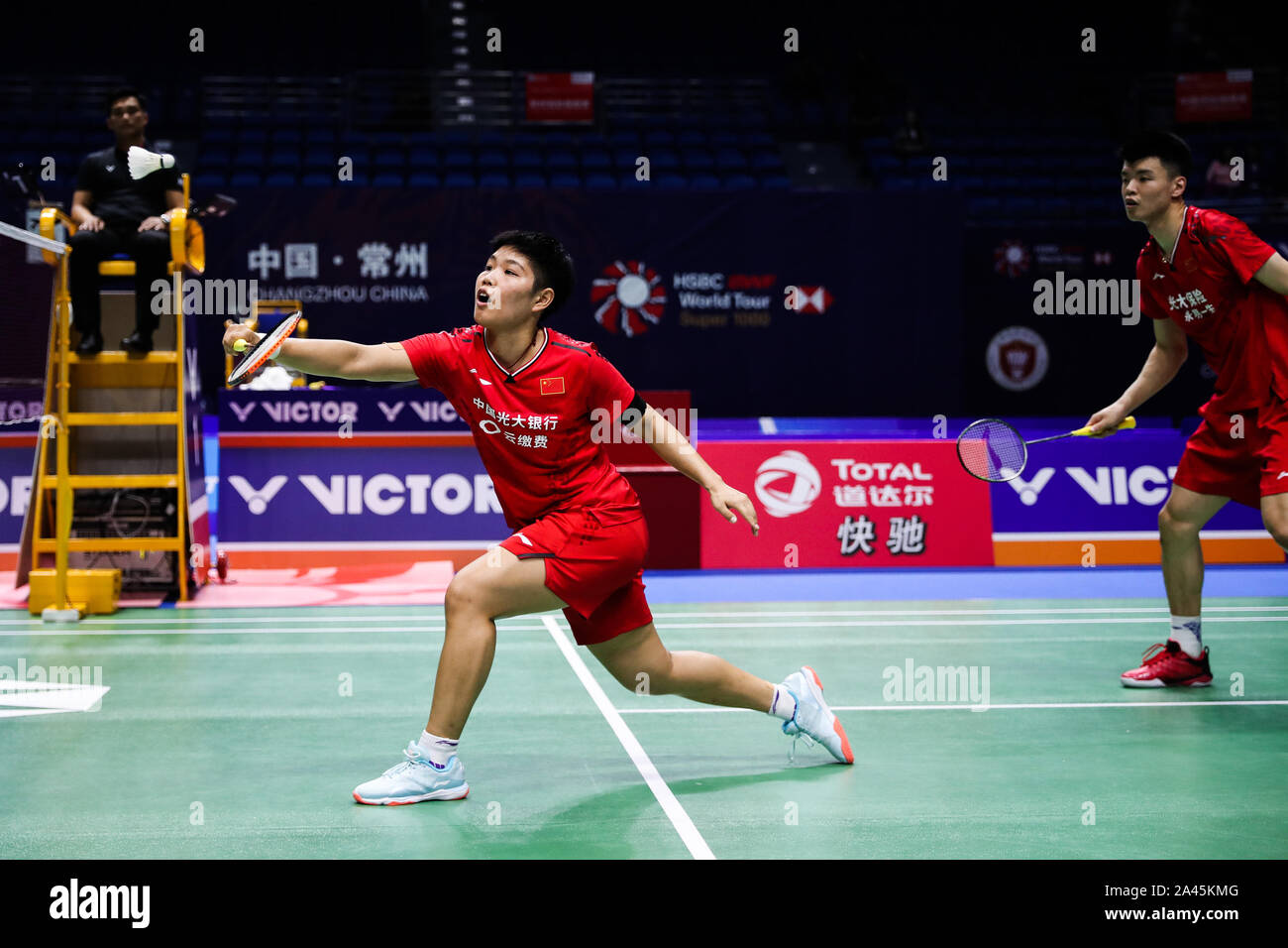 Chinese professional badminton players Wang Yilv and Huang Dongping ...