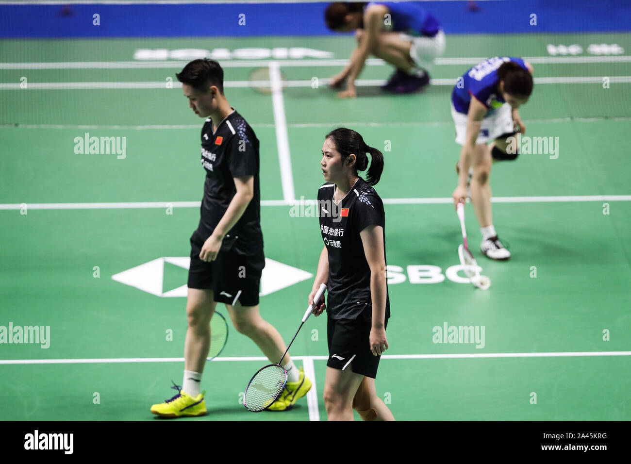 Chinese professional badminton players Li Wenmei and Zheng Yu compete ...