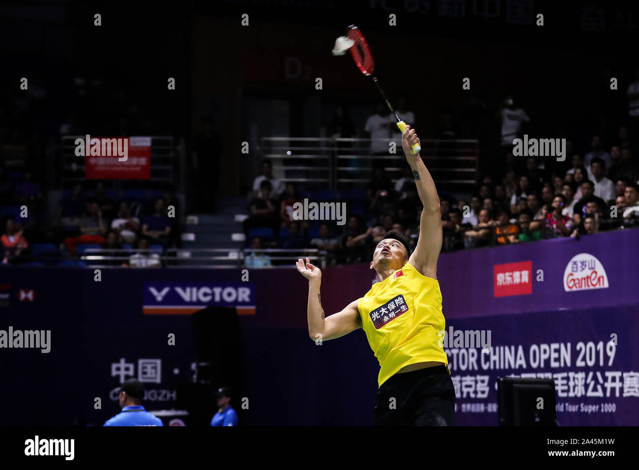 Chinese professional badminton player Lin Dan competes against Japanese ...